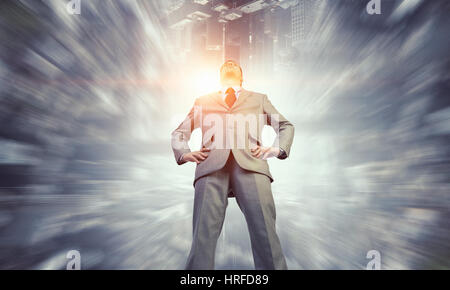 Giant businessman with long legs looking away Stock Photo - Alamy