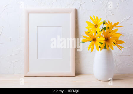 White frame mockup with yellow rosinweed flowers in pitcher. Empty ...