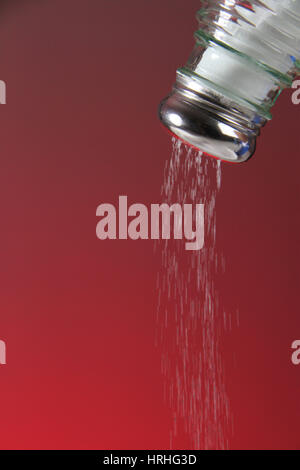 Salt Pouring out of Salt Shaker Stock Photo - Alamy
