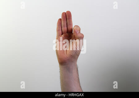 Hand signing number nine Stock Photo - Alamy