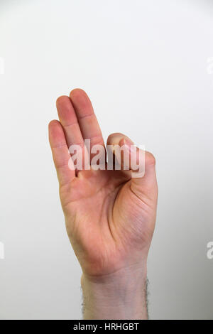 Hand signing number nine Stock Photo - Alamy