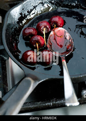 frying pan made from red ceramic on a white background. long lasting ...