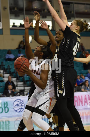 Virginia guard Jocelyn Willoughby (13) drives past Louisville guard ...