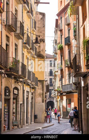 Narrow balcony filled street, Barri Vell Old Quarter, Girona, Spain ...