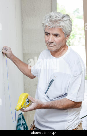 senior builder use tape-line for measure. measurement. engineer size ...