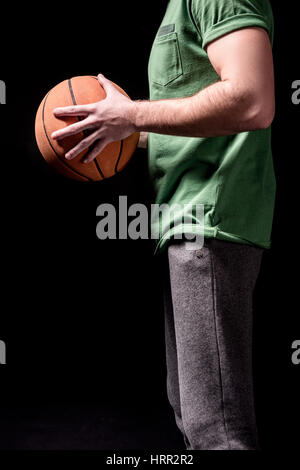 Vertical partial side view of black office chair with headrest isolated ...