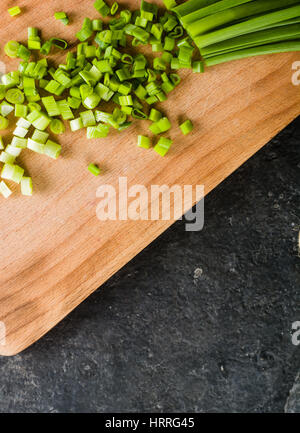Green feathers of a young spring onion. Vitamins from the garden Stock ...