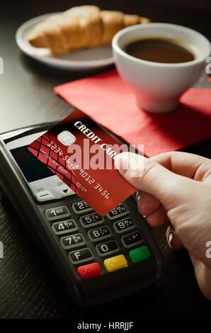 Man using terminal to pay Stock Photo - Alamy