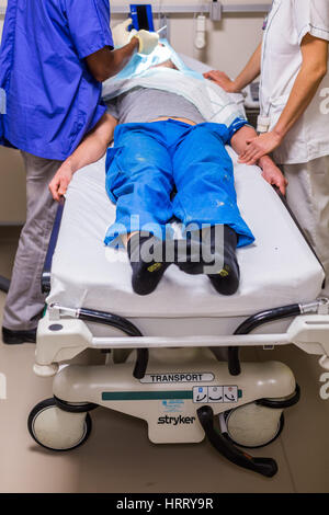 Patient after an accident at work (stitches on the lip), emergency ...