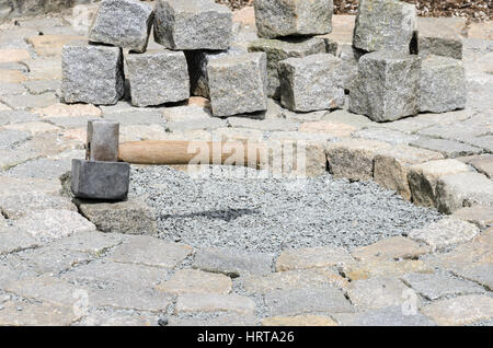 Pavement rocks, stones and cobblestone blocks, construction of path ...
