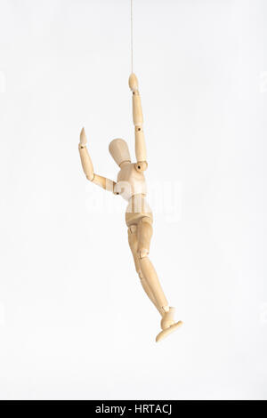 Artist's mannequin hanging mid-air by a piece of string - metaphor for ...