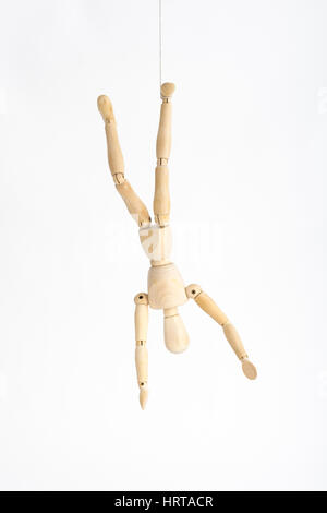 Artist's mannequin hanging mid-air by a piece of string - metaphor for ...