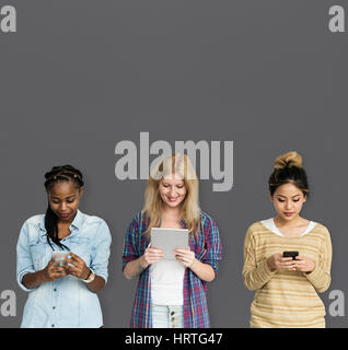 Group of Girls Using Technology Gadgets Stock Photo - Alamy