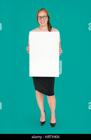 Charming smiling girl holding blank paper sheet Stock Photo - Alamy