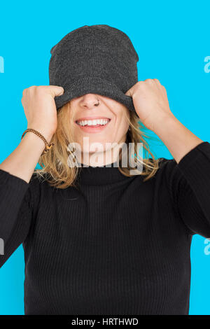 Caucasian Lady Beanie Covering Eyes Smiling Stock Photo - Alamy