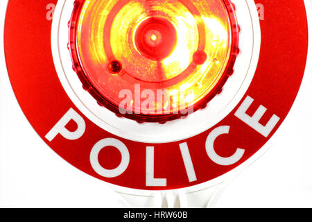 A handheld police traffic control sign with Halt Polizei, German for ...