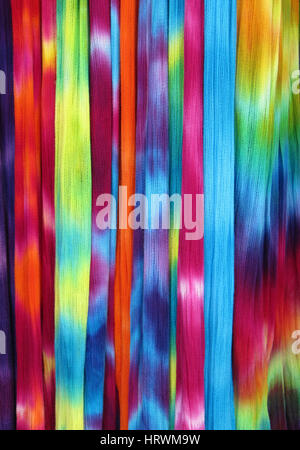 Colours of the rainbow, brightly coloured material hanging up to dry ...