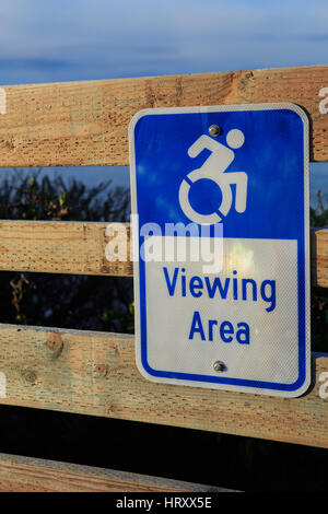 Disabled handicapped wheelchair clifftop viewing area sign on the coast ...