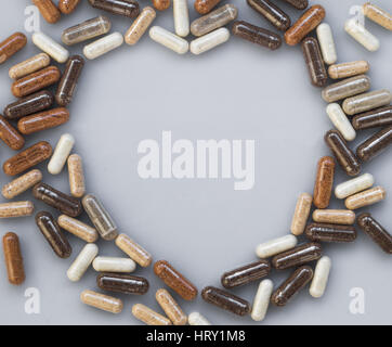 Multicolored pills and capsules in plastic bottle on Colored background ...