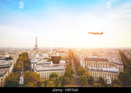 Airplane flying over Eiffel Tower in morning, Paris, France. Eiffel ...
