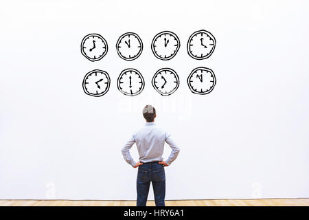 Businessman in time management concept Stock Photo - Alamy