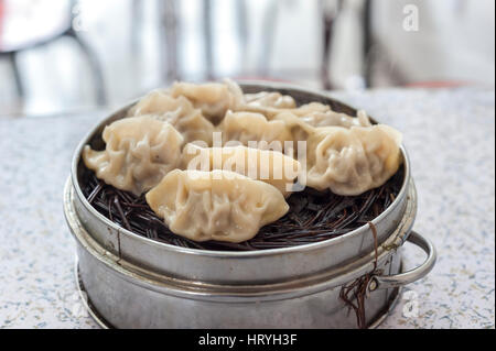 Traditional Chinese dumplings Jiaozi with pork and sauerkraut filling ...