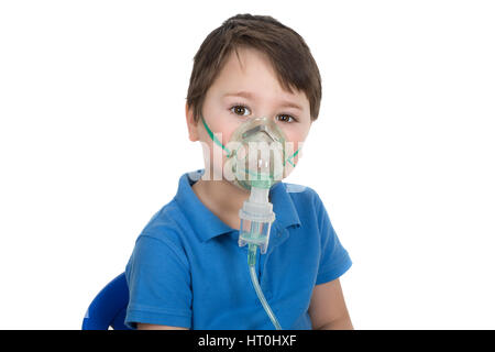 Inhalation mask on a white background behind which three jars with ...