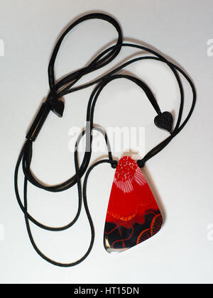 Necklace of red plastic on a white background ethnic Stock Photo - Alamy
