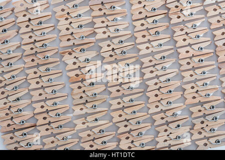 Macro photo of wooden mini clothes pegs. Metaphor for currency pegging ...