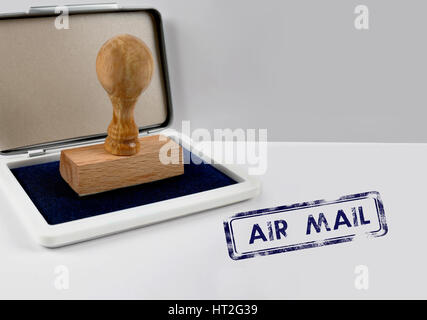 E-mail @ at symbol on an office desk with man on laptop computer Stock ...