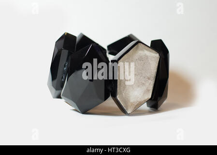 Ethnic bracelet hand white background plastic multi-colored stones ...