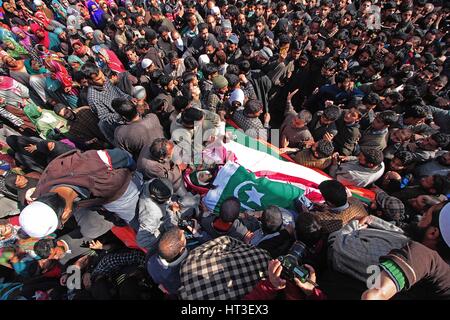 India. 06th Mar, 2017. Kashmiri Muslims gather near the corpse of top ...