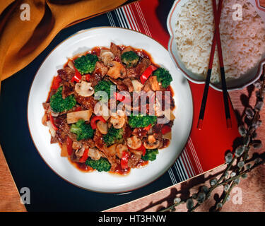 Delicious beef stir-fry with colorful vegetables and sprouts, served on ...
