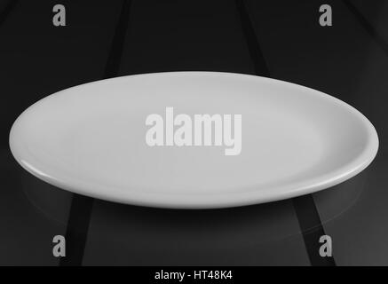 Porcelain round square shallow dish Stock Photo - Alamy