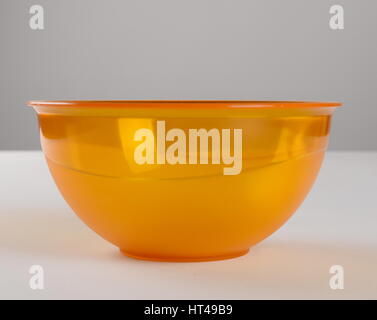 Orange transparent plastic deep dish, isolated on white background ...