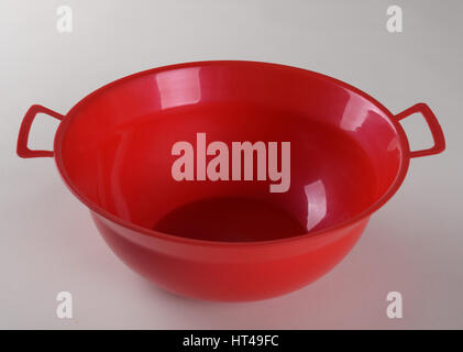Red deep plastic bowl with handles Stock Photo - Alamy
