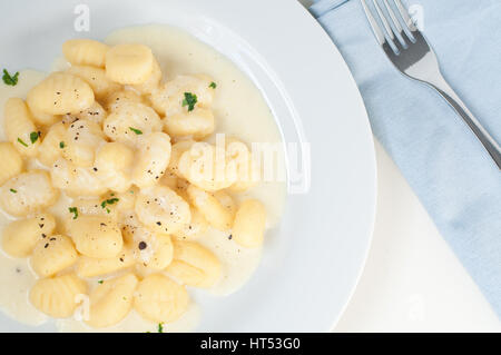 potato gnocchi with fontina cream,italy Stock Photo - Alamy