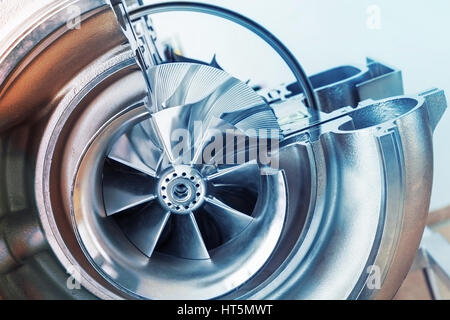 Turbocharger structure scheme with cross section,toned photo with ...
