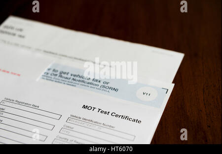 UK vehicle MOT test certificate and tax renewal form Stock Photo - Alamy
