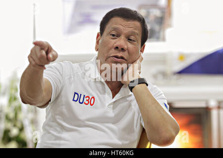 Philippine President Rodrigo Duterte talks with kidnap victim Rexon ...