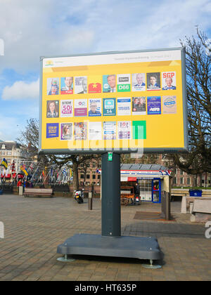 Board with the election posters of all Dutch political parties at the ...