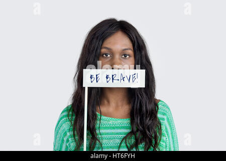 Be strong and brave symbol. Concept word Be strong Be brave on wooden ...