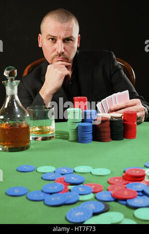 Male hand holding stack of generic business newspaper defocused blur ...