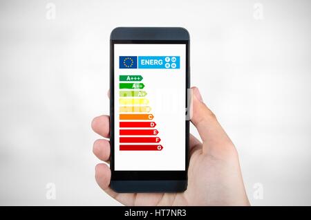Hand holding a smartphone with efficiency concept Stock Photo - Alamy