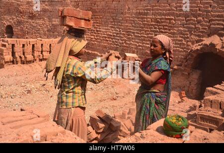 Dimapur, India. 08th Mar, 2017. An Indian woman labour works at a ...