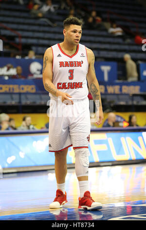 Louisiana Lafayette forward Justin Miller (55) is fouled by Kansas ...
