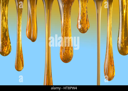 Golden syrup or treacle dripping Stock Photo - Alamy