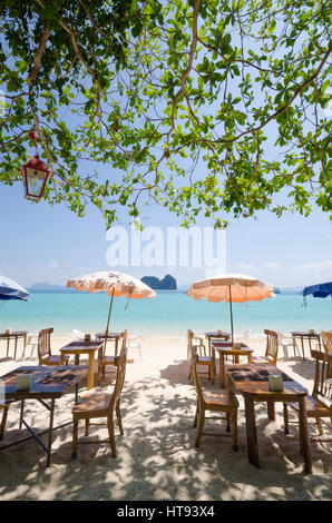 Group of chairs and umbellar along the clear beach Stock Photo - Alamy