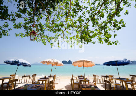 Group of chairs and umbellar along the clear beach Stock Photo - Alamy