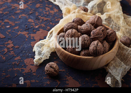 Walnuts on concrete background. Selective focus Stock Photo - Alamy